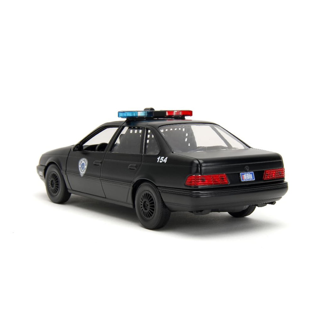 1986- FORD TAURUS OCP - ROBOCOP COM BONECO - 1/24